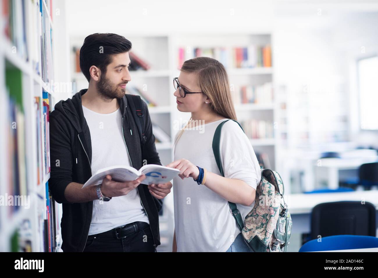 students couple in school library Stock Photo - Alamy