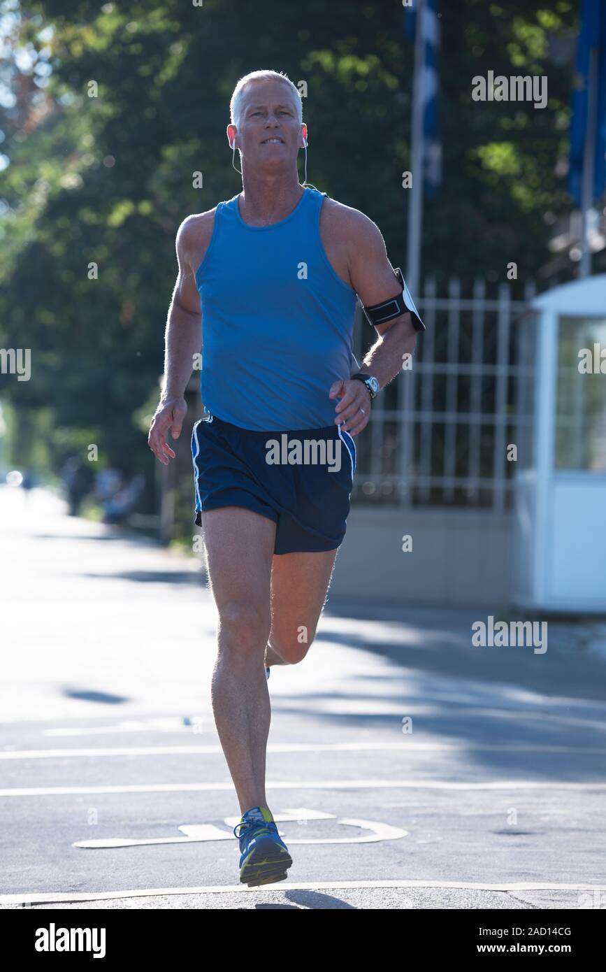 handsome senior man jogging Stock Photo - Alamy