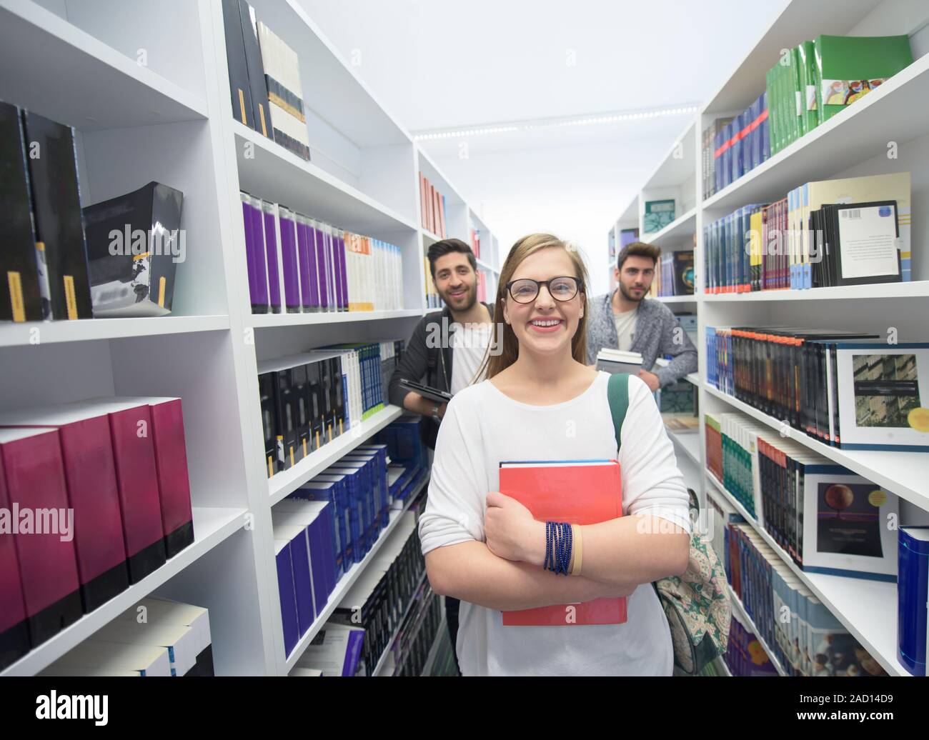 students group in school library Stock Photo - Alamy