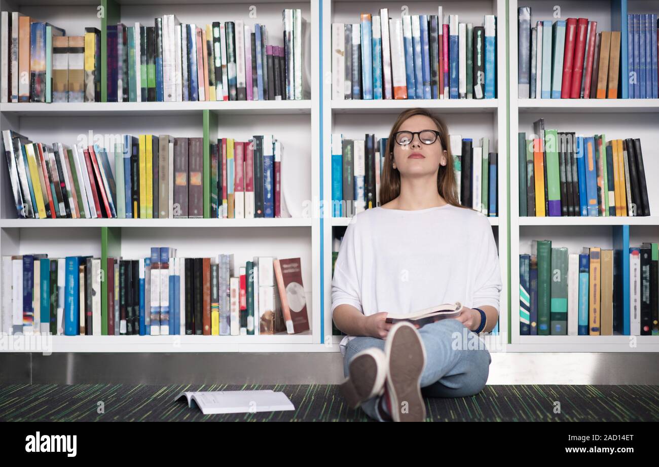 female student study in library, using tablet and searching for ...