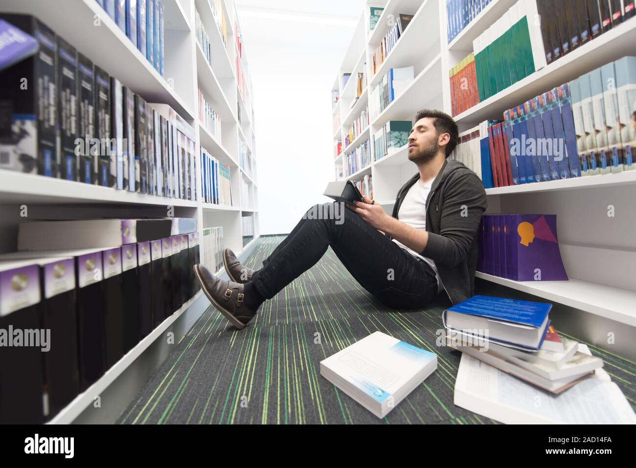 student study in school library Stock Photo - Alamy