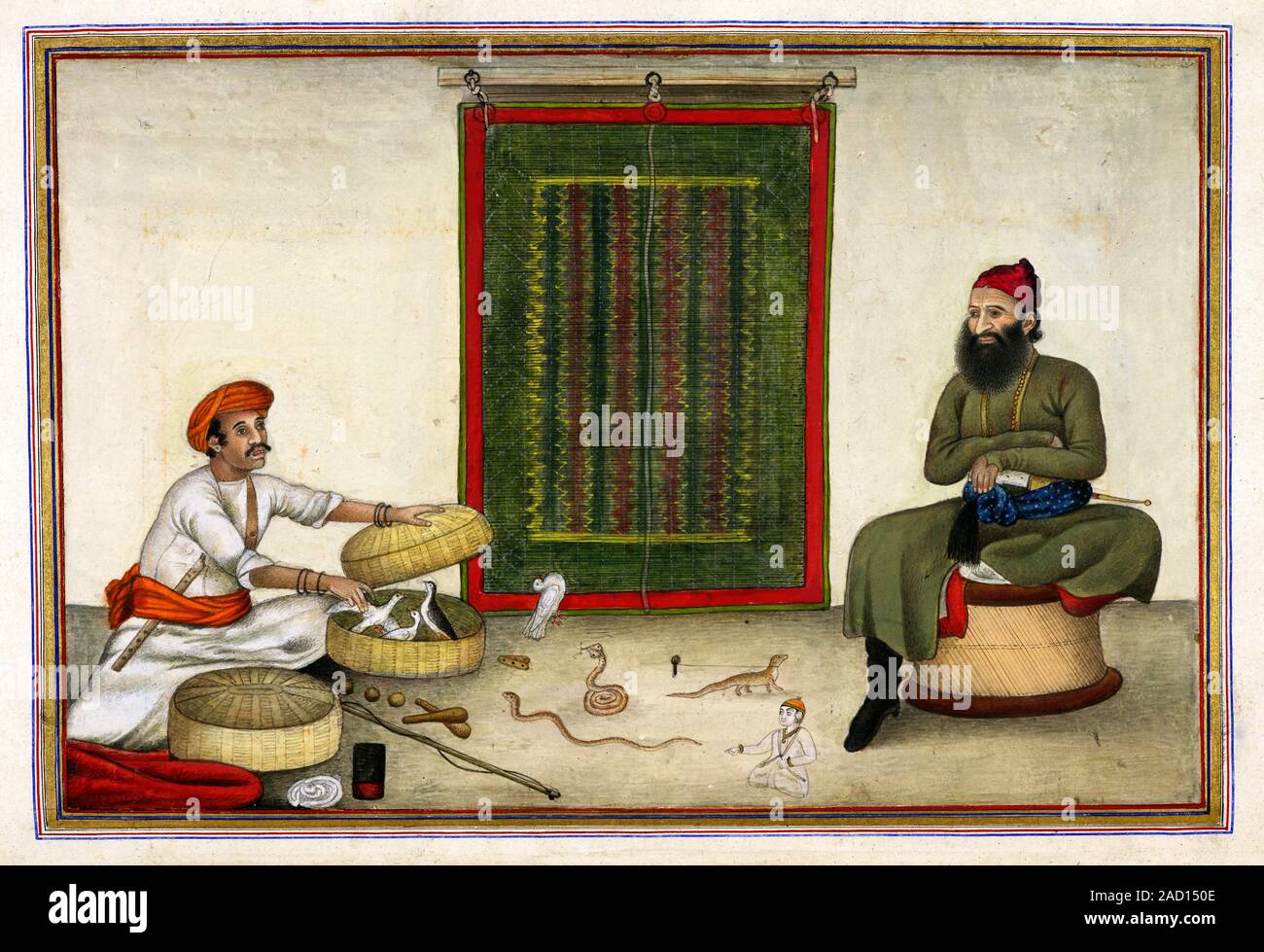 Animal conjuror in India. 19th-century illustration of a conjurer (left ...