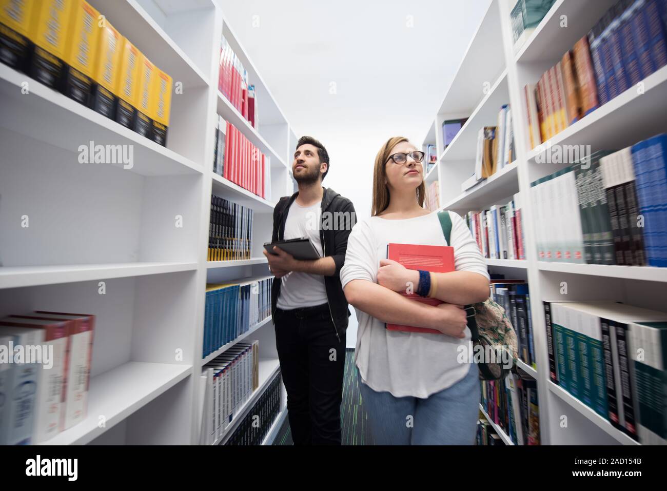 students group in school library Stock Photo - Alamy