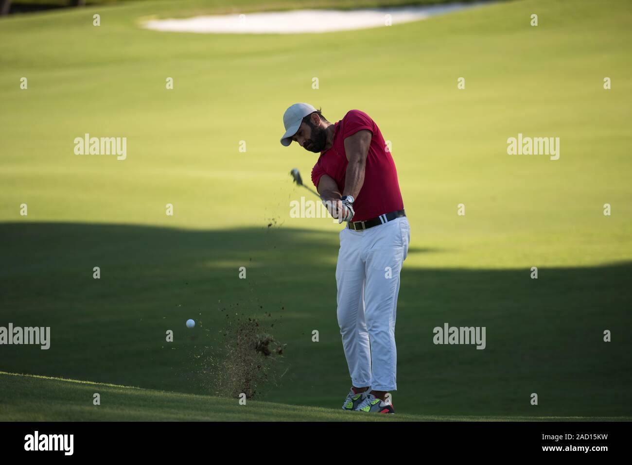 golf player hitting long shot Stock Photo - Alamy