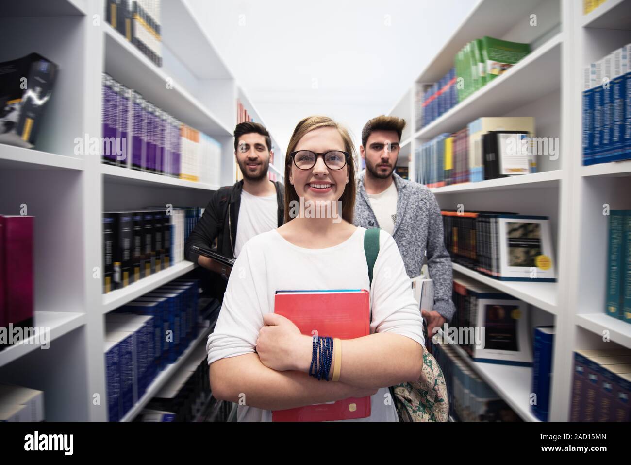 students group in school library Stock Photo - Alamy