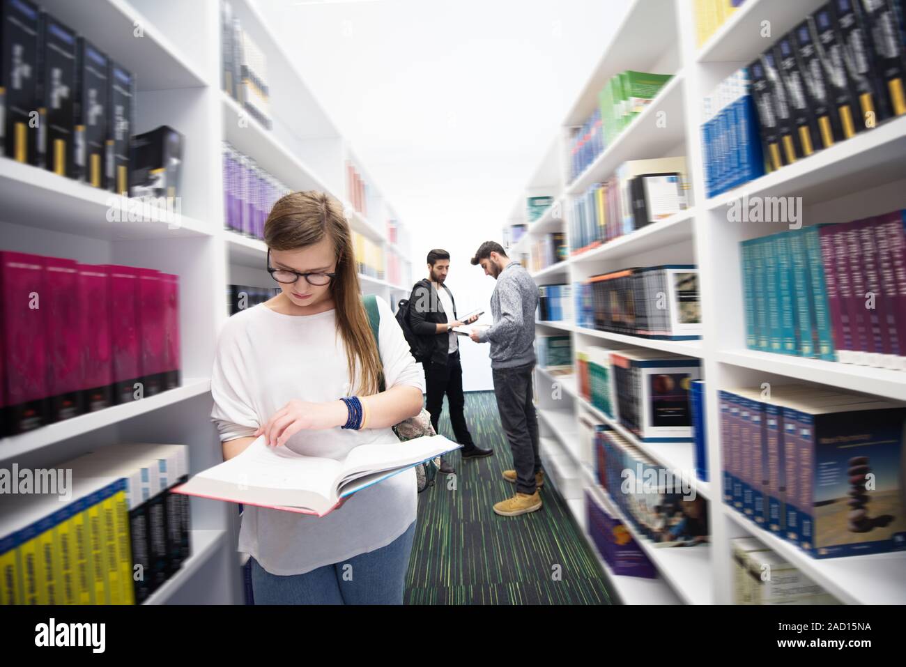 students group in school library Stock Photo - Alamy