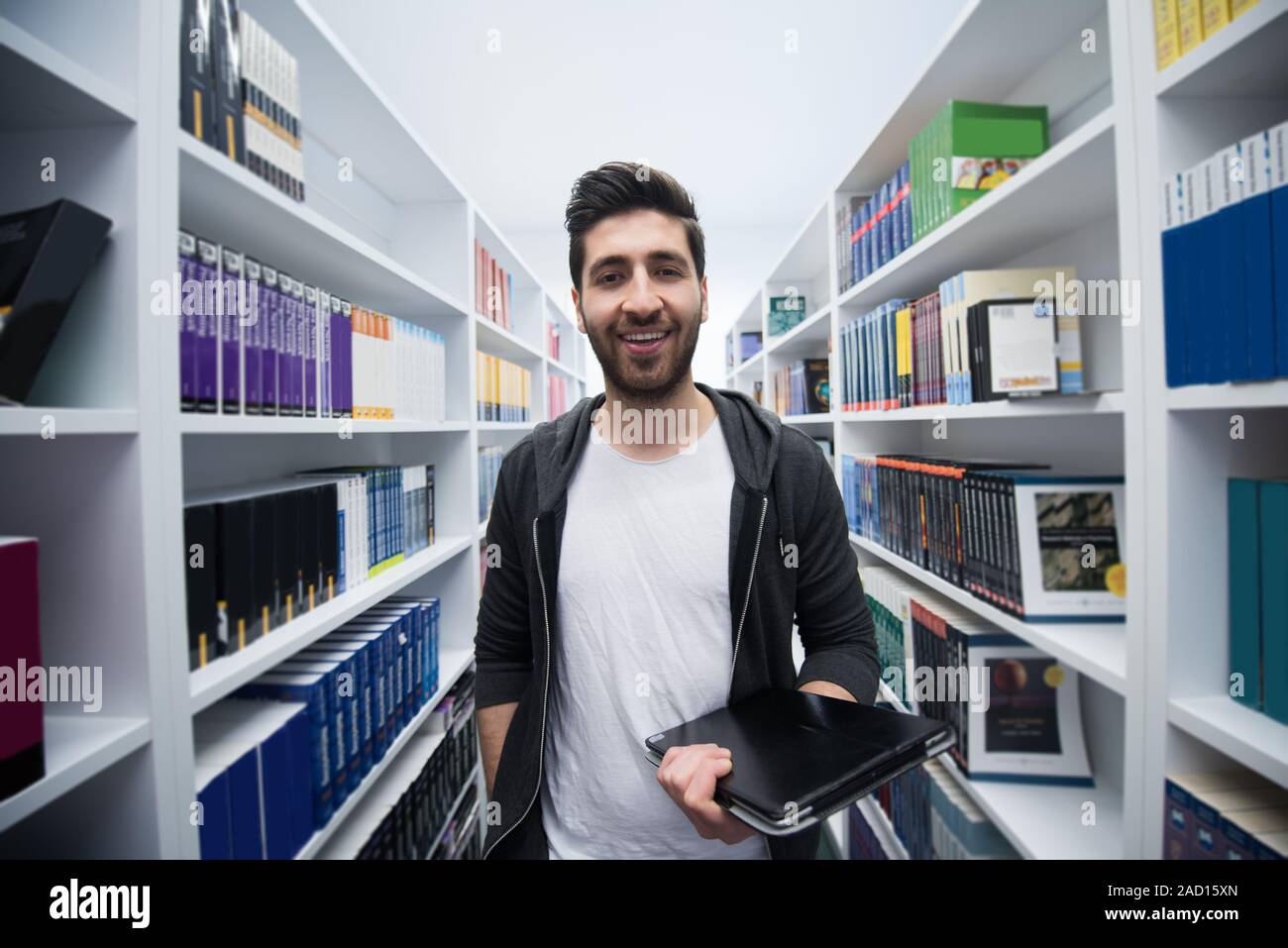student with tablet in library Stock Photo - Alamy
