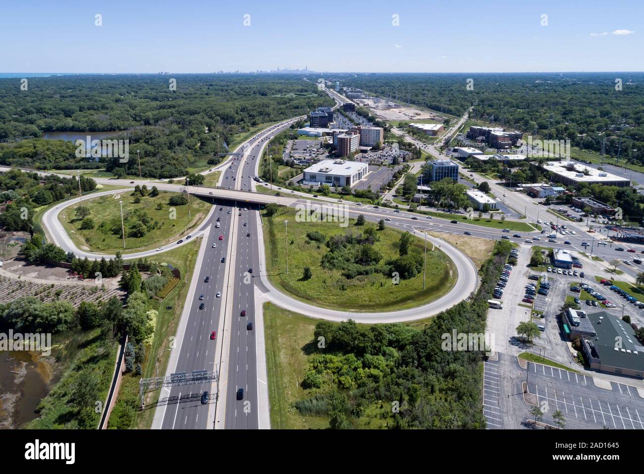 Aerial view of a highways, overpasses, ramps and office buildings in a ...