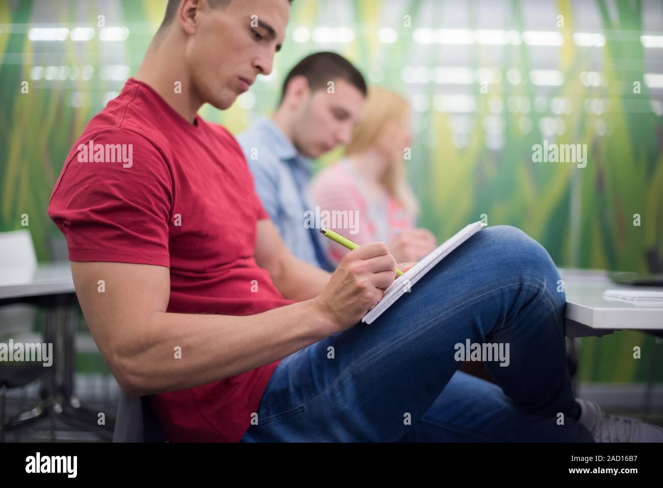 Adult students taking test in hi-res stock photography and images - Alamy