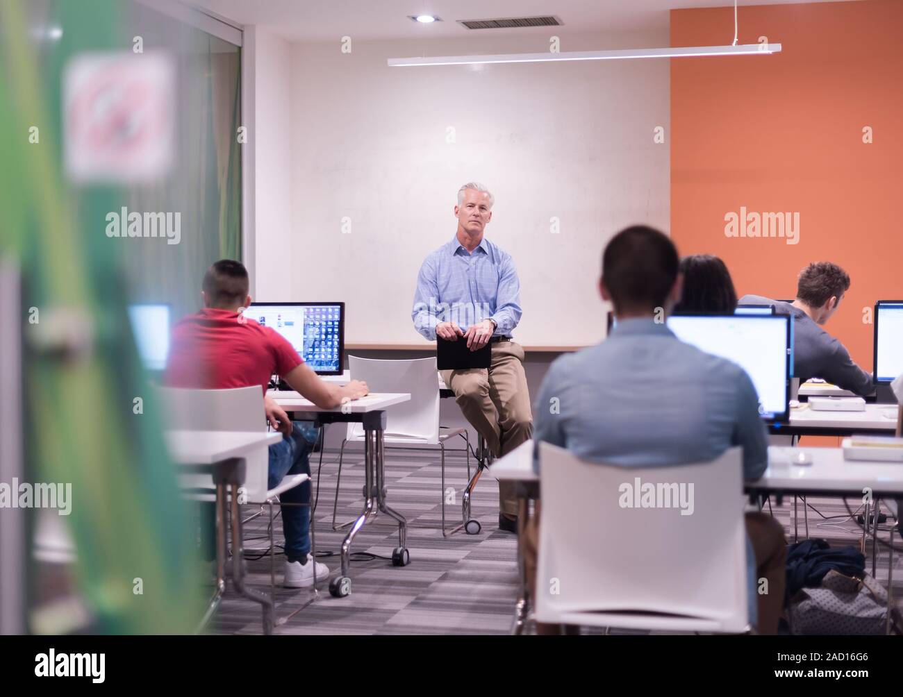 teacher and students in computer lab classroom Stock Photo - Alamy