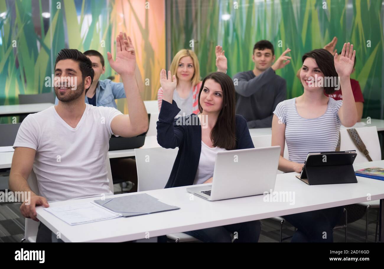 teacher with a group of hi school students in classroom Stock Photo - Alamy