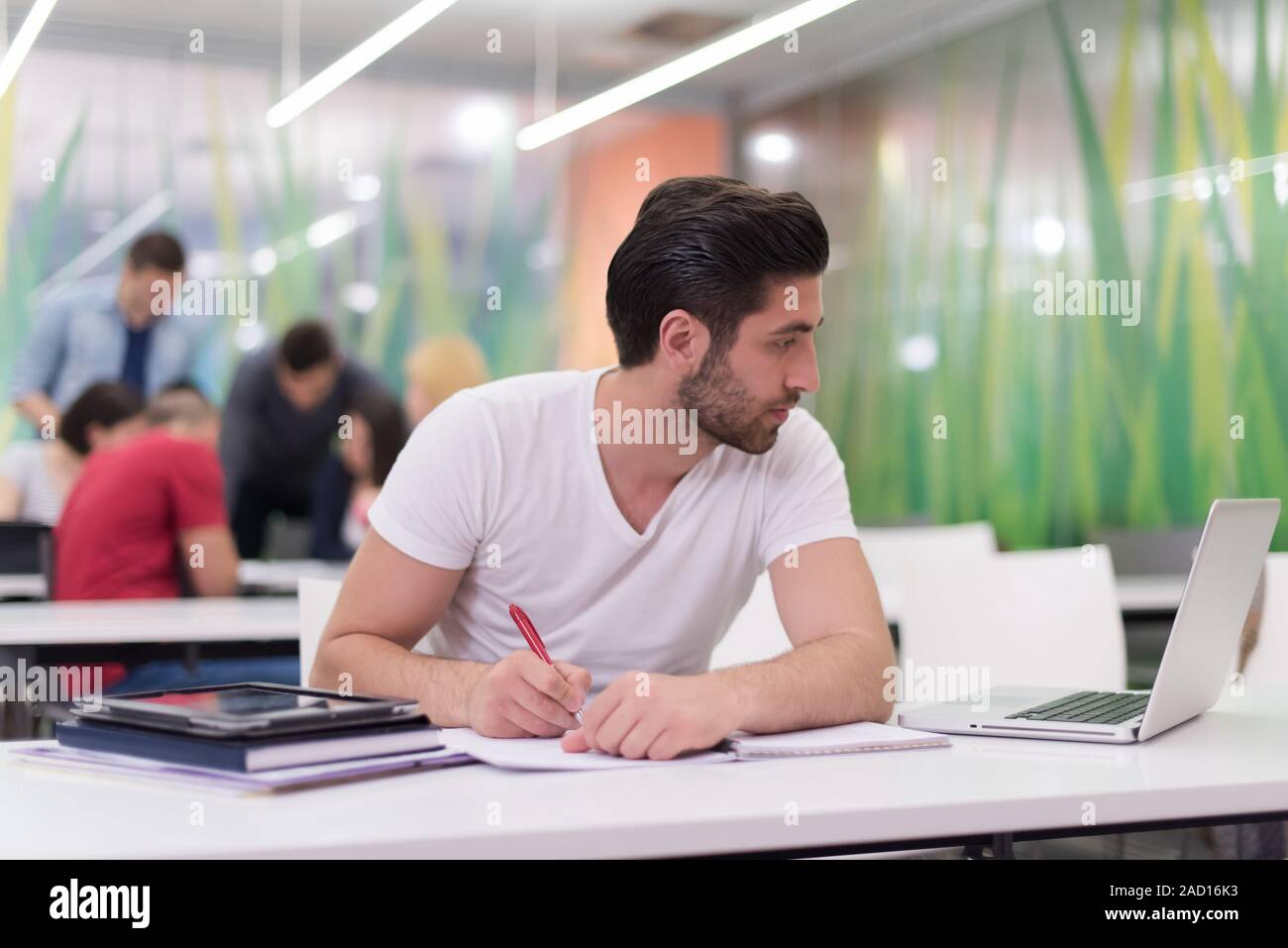 male student in classroom Stock Photo - Alamy