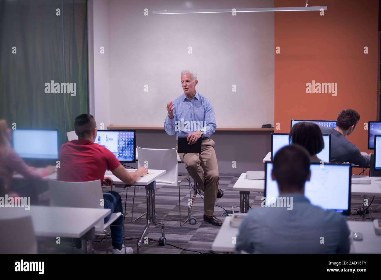 teacher and students in computer lab classroom Stock Photo - Alamy