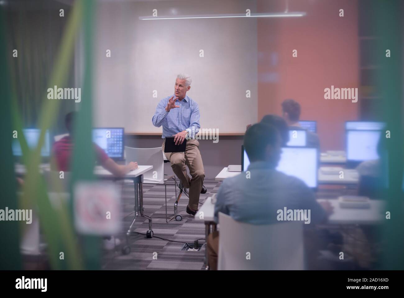 teacher and students in computer lab classroom Stock Photo - Alamy