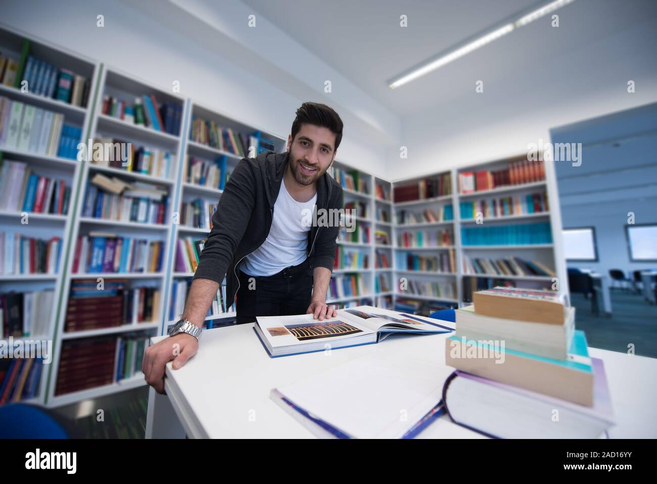 student study in school library Stock Photo - Alamy