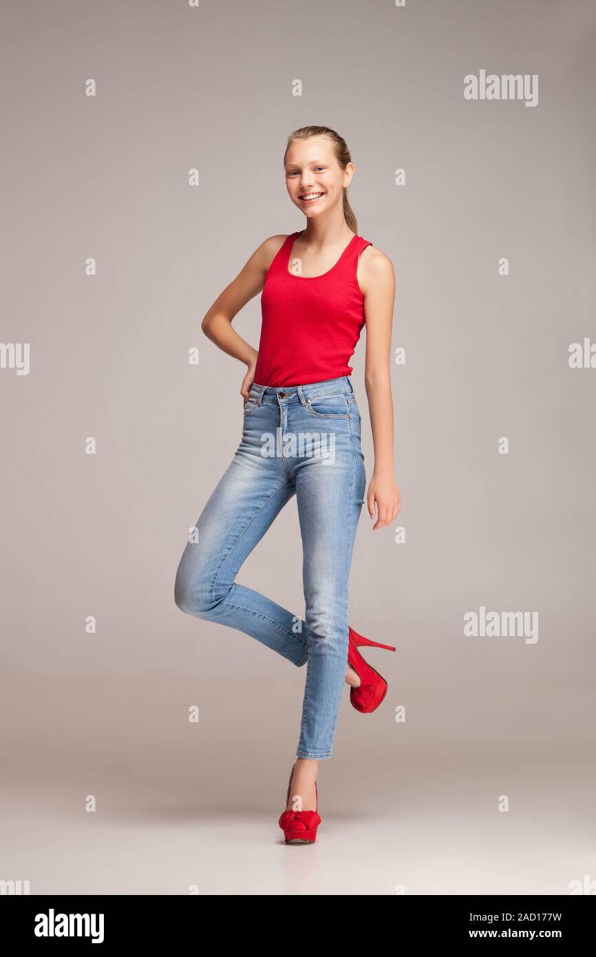Side view of smiling model looking at camera Stock Photo - Alamy