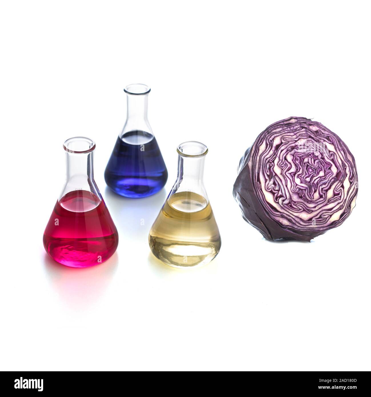 Natural pH indicator. Three flasks containing chemicals of different pH ...