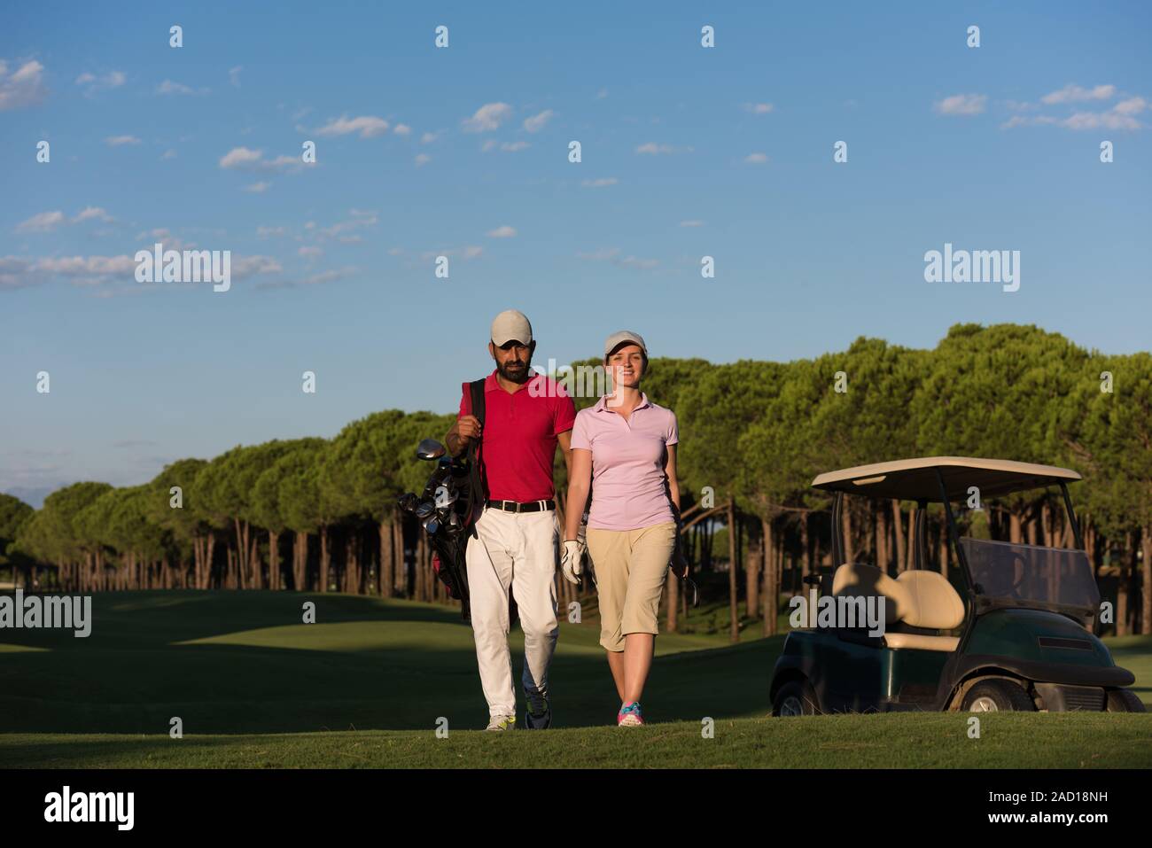 portrait of golfers couple on golf course Stock Photo - Alamy
