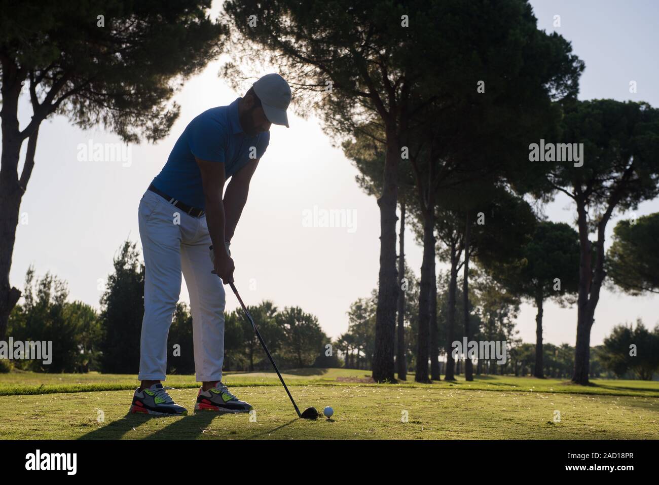 golf player hitting shot Stock Photo - Alamy