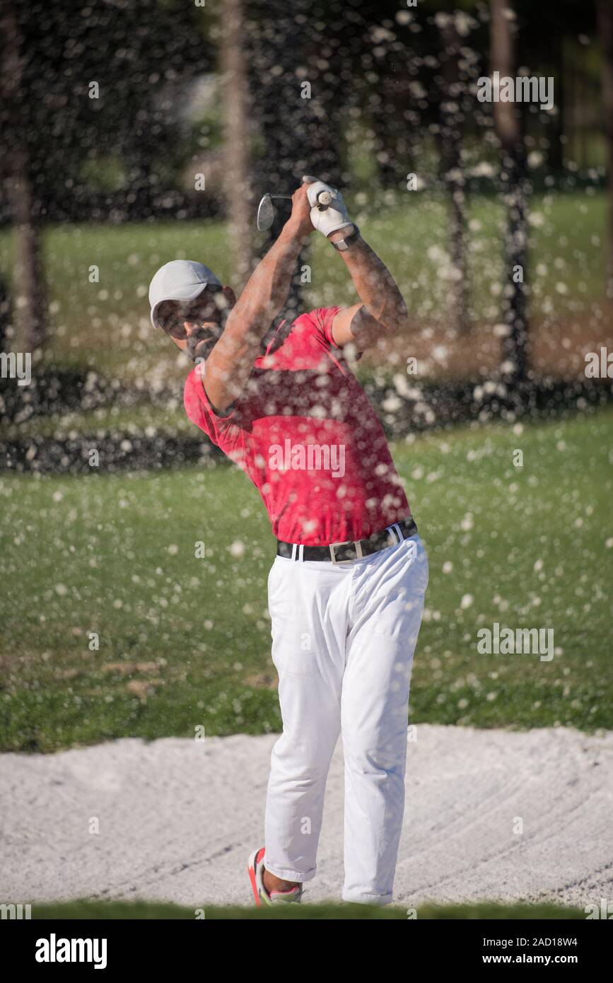 golfer hitting a sand bunker shot Stock Photo - Alamy