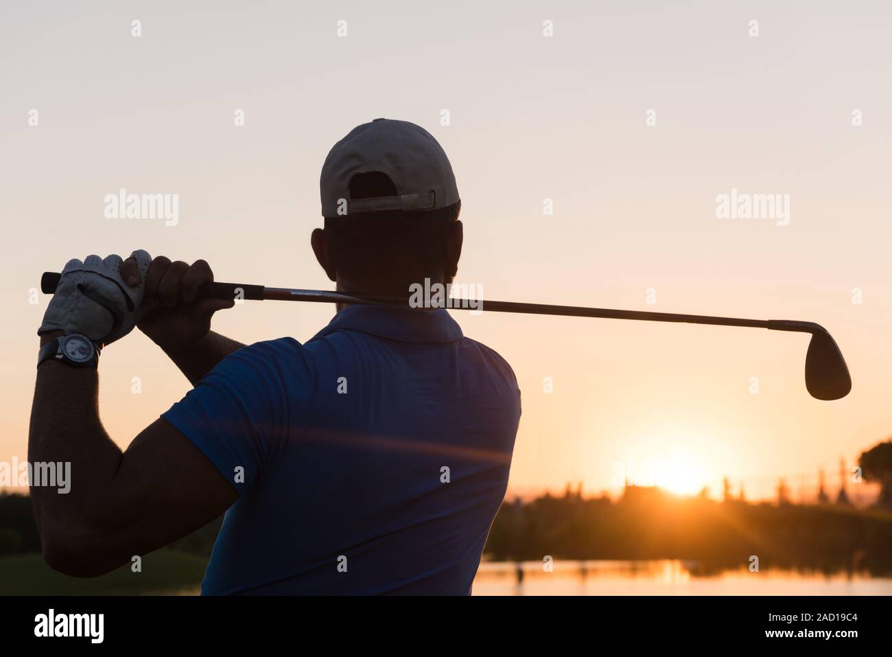 golfer hitting long shot Stock Photo - Alamy