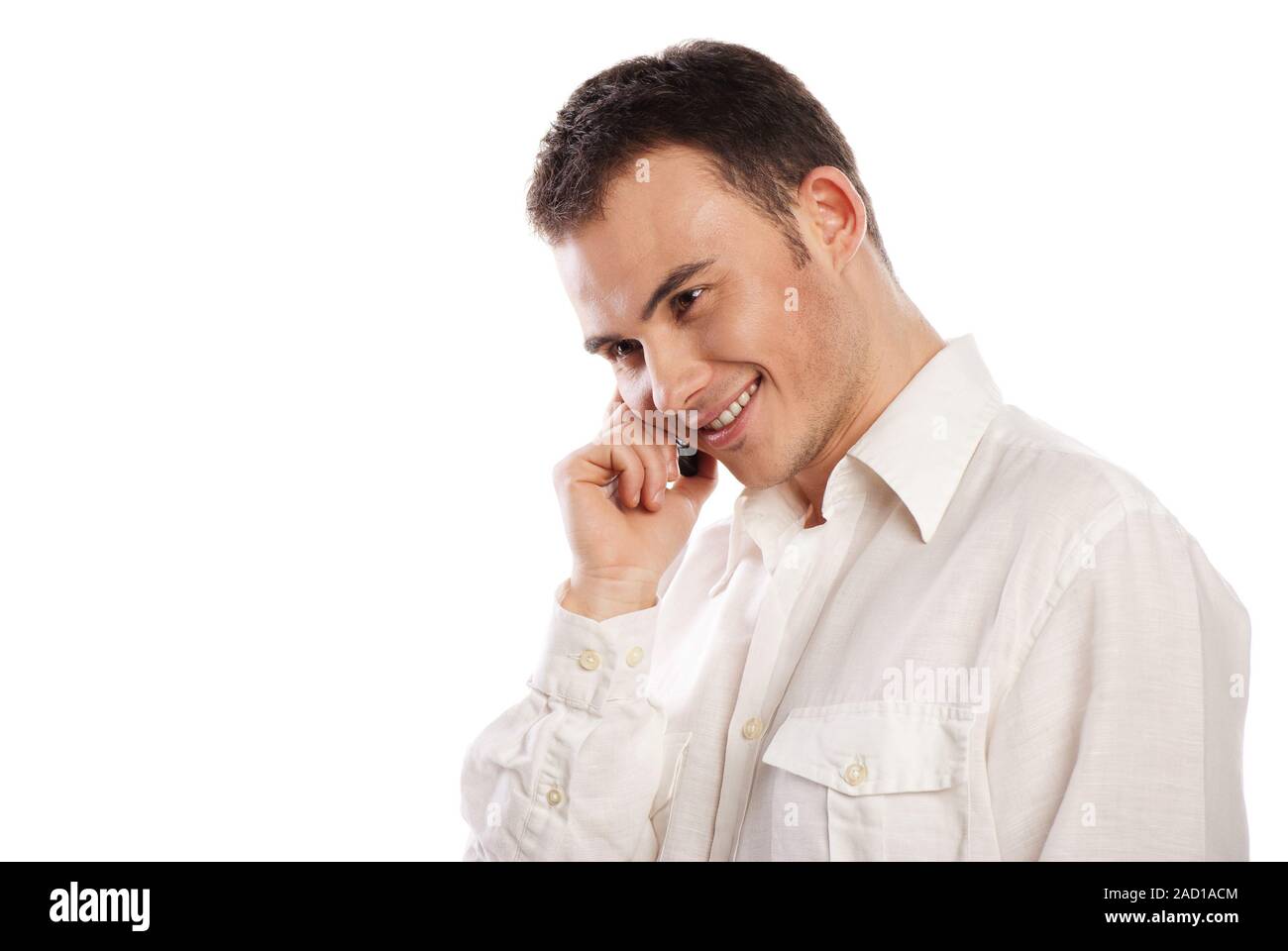 Man smiling and talking on phone isolated Stock Photo - Alamy