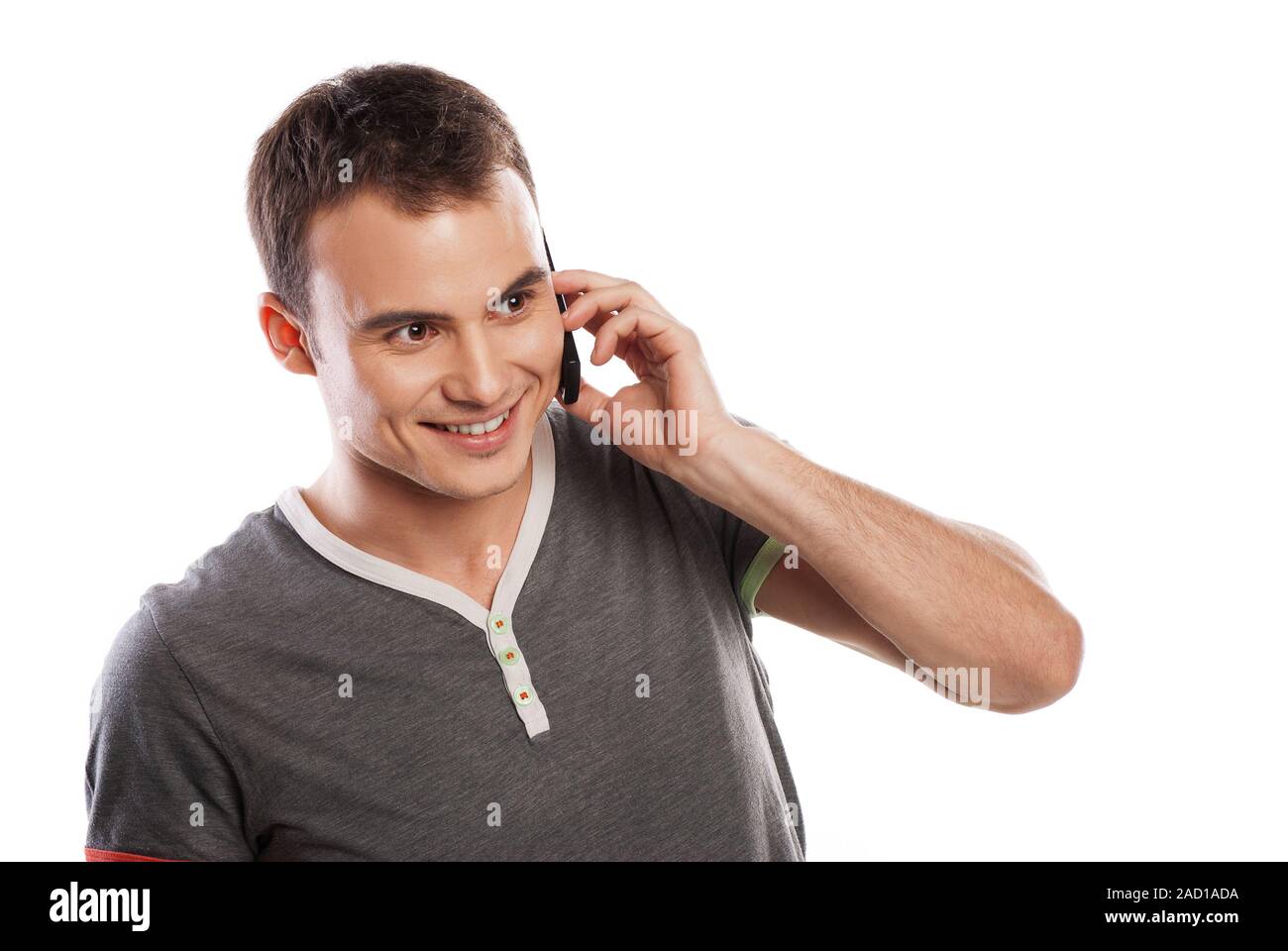 Happy man answering the phone isolated Stock Photo - Alamy