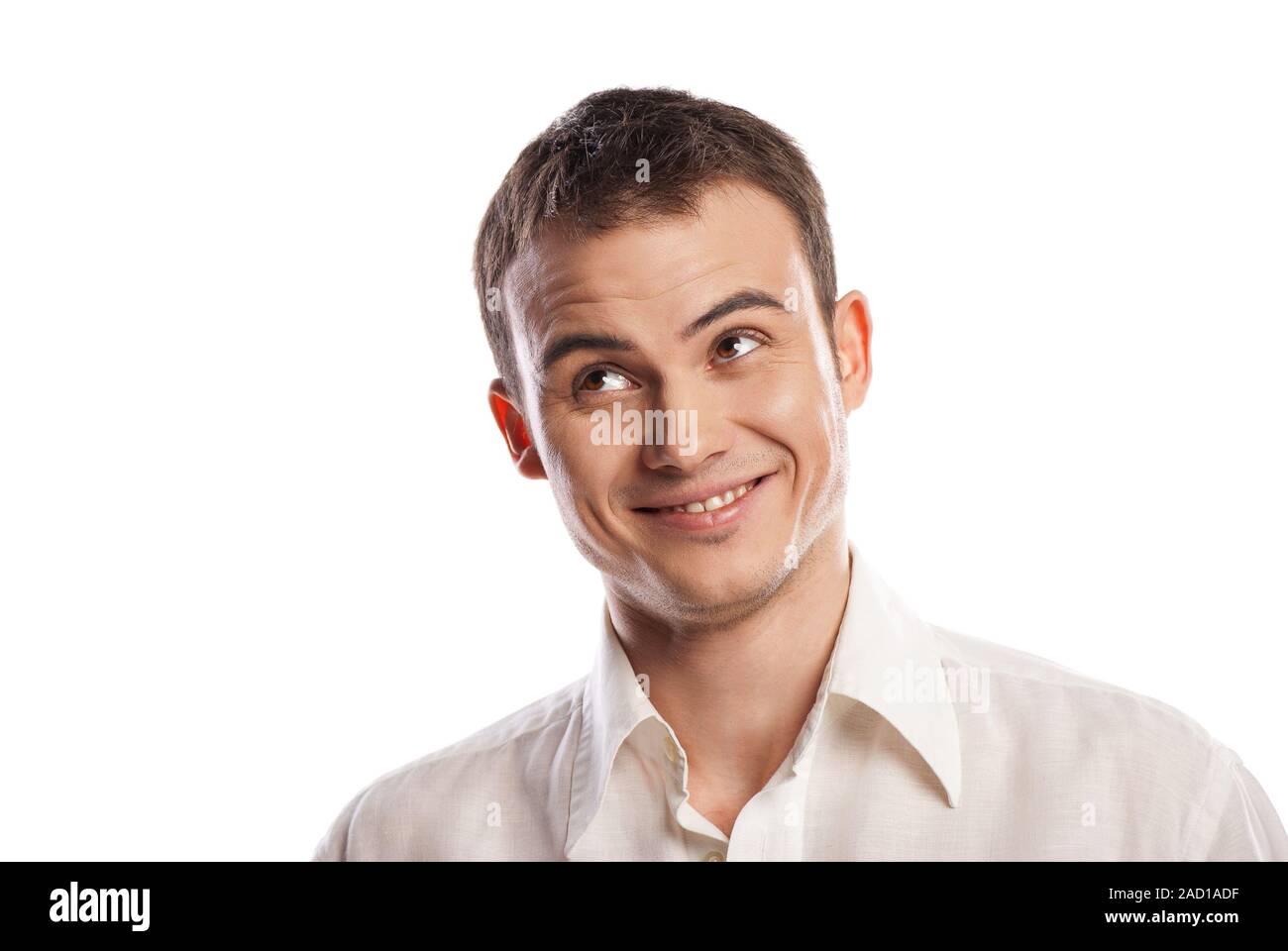 Handsome smiling young man looking up isolated Stock Photo - Alamy
