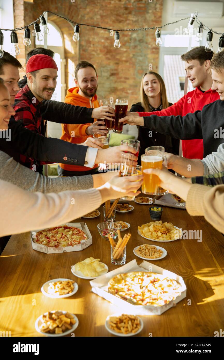 Happy co-workers celebrating while company party and corporate event ...