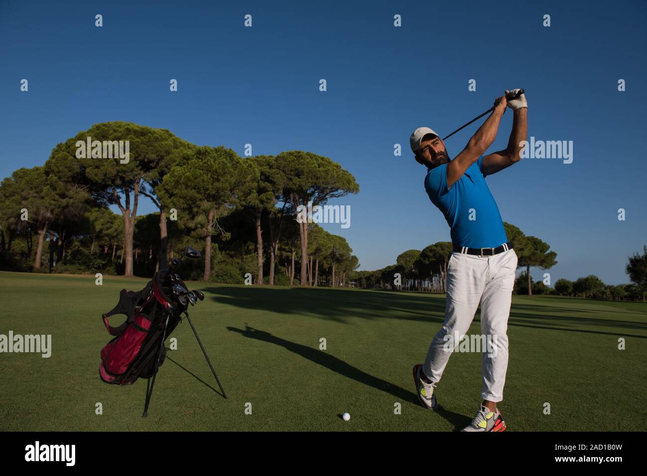golf player hitting shot Stock Photo - Alamy