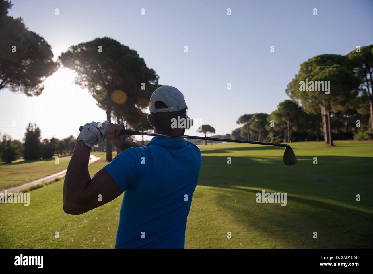 golf player hitting shot Stock Photo - Alamy