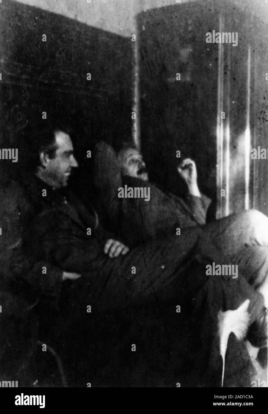 Albert Einstein (1879-1955), Swiss-German physicist talking to another ...