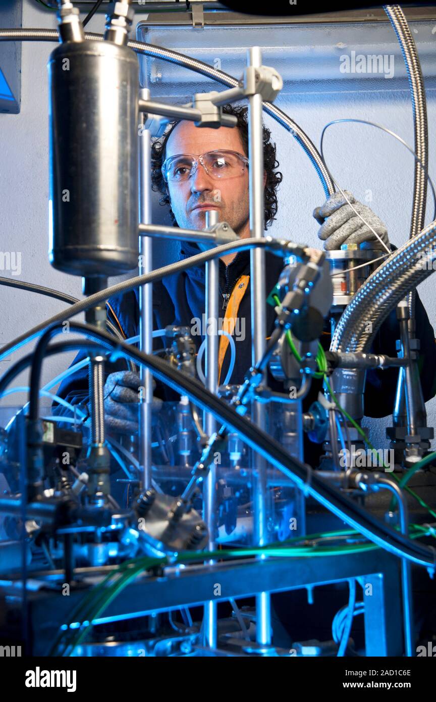 Technician in the control room at a carbon nanotube production facility ...