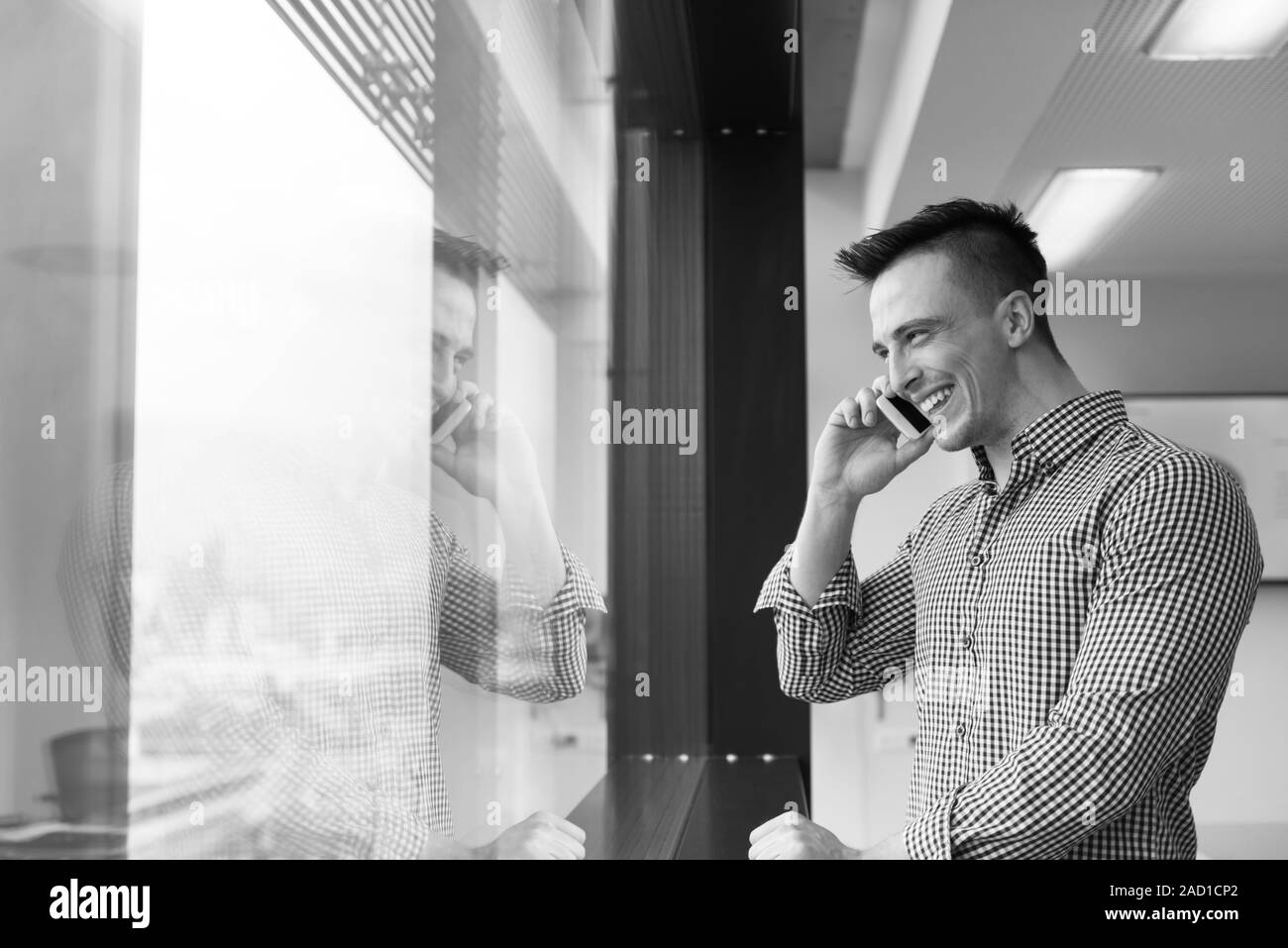 Happy positive man using Black and White Stock Photos & Images - Alamy