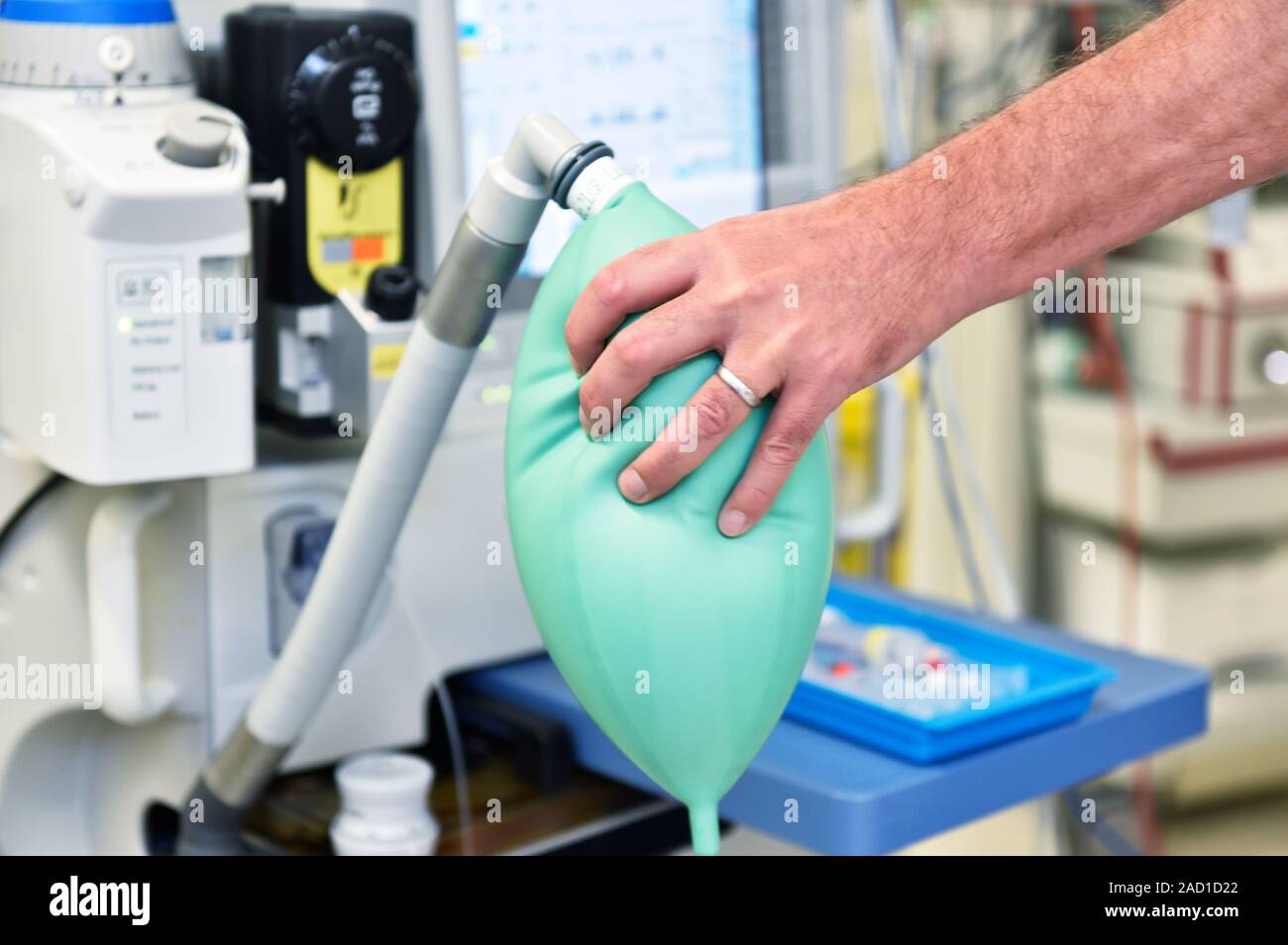 Pump for anaesthesia machine. Close-up of the hand of an anaesthetist ...