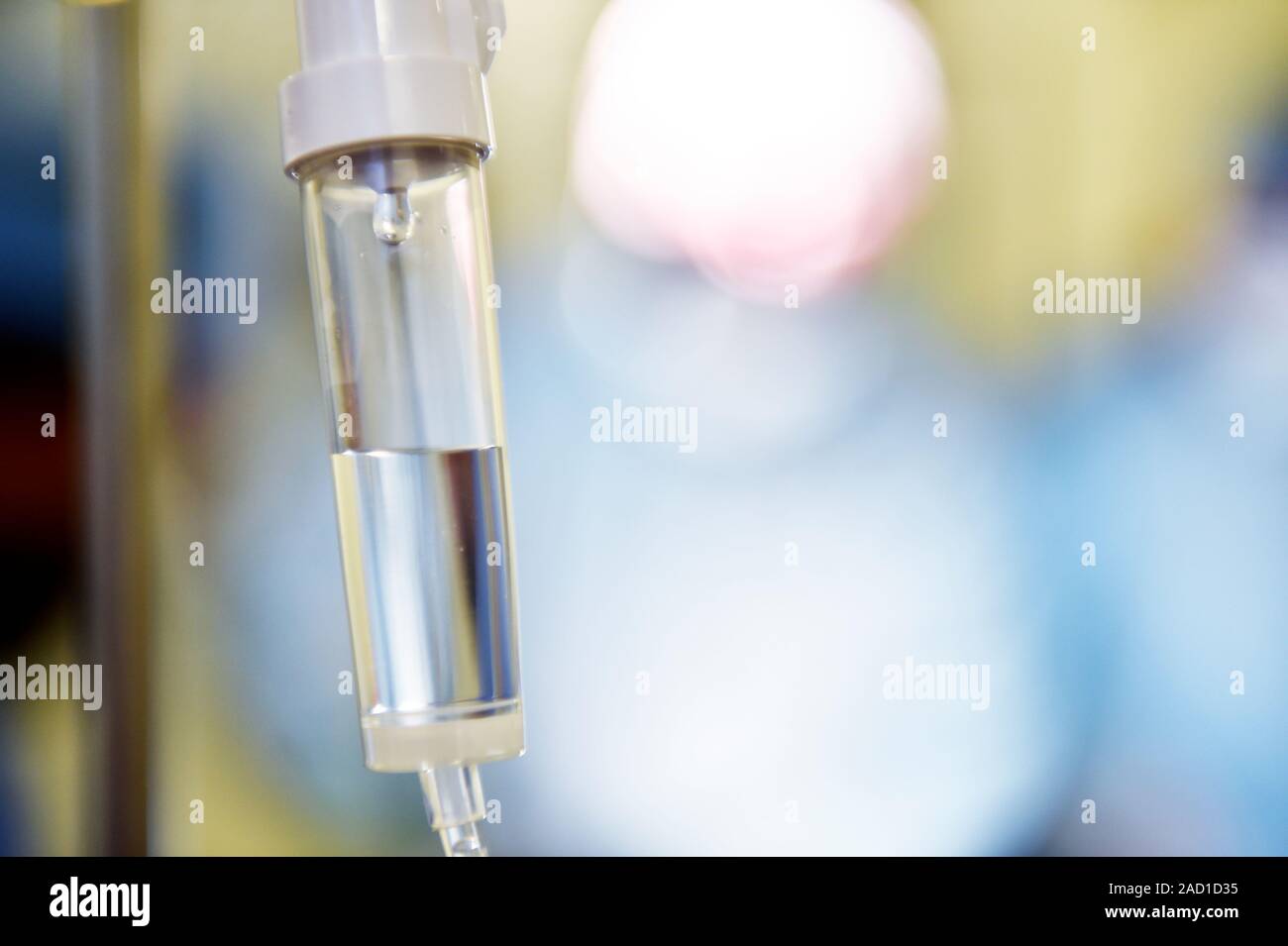 Intravenous drip. Close-up of the valve for an intravenous drip bag. A ...