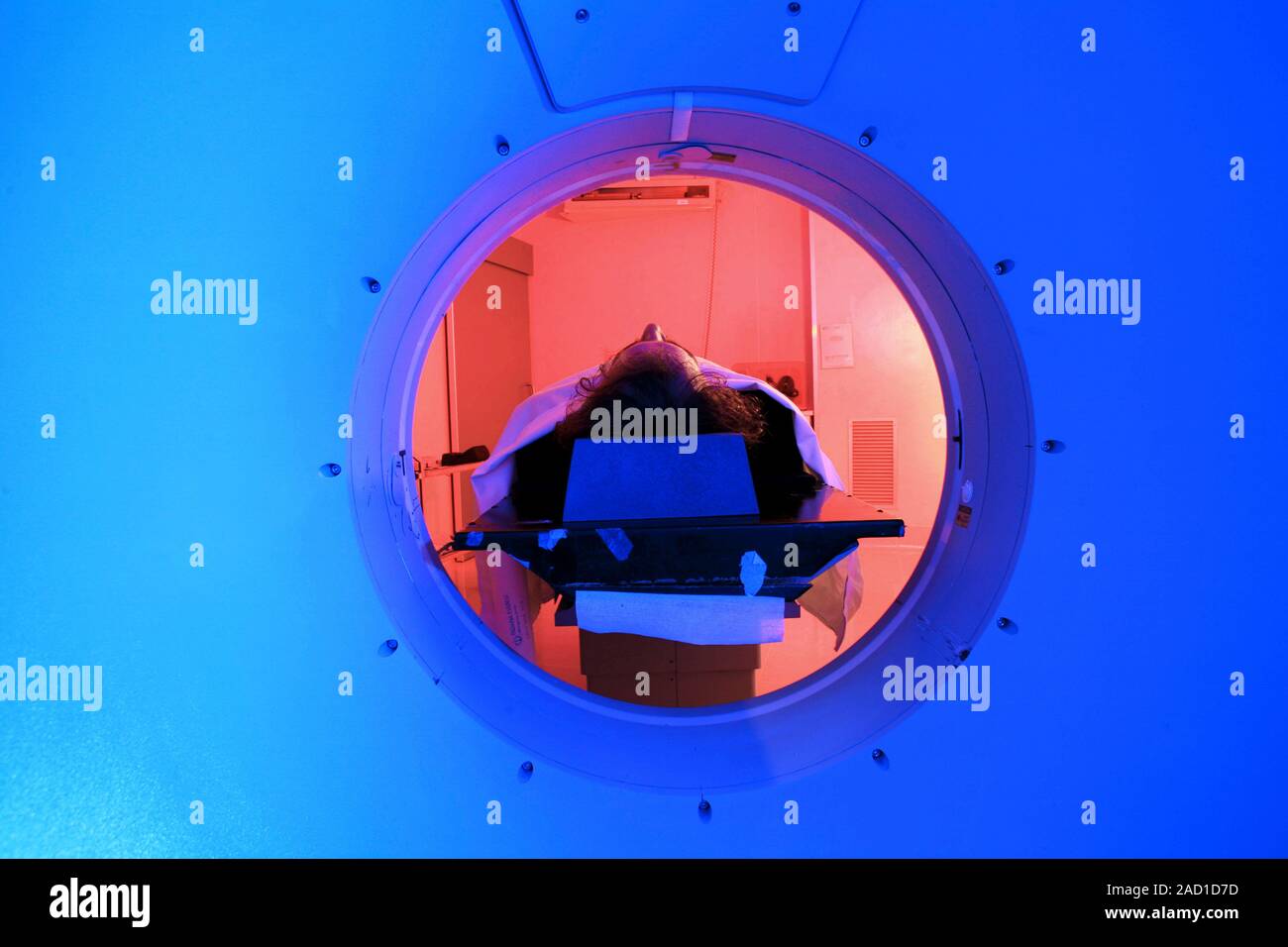 Positron emission tomography (PET) scanner, with a patient being ...