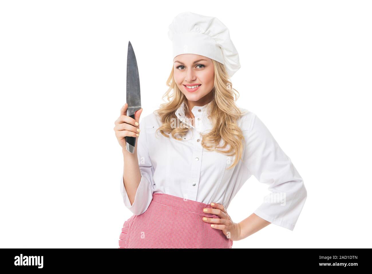 Beautiful blonde woman in chef uniform with knife Stock Photo - Alamy