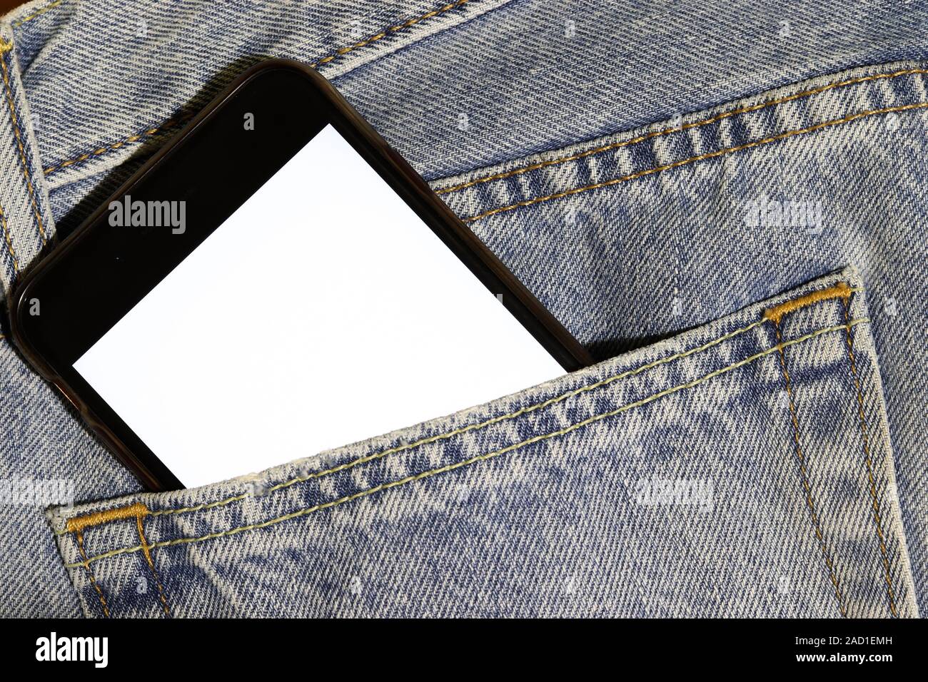 Mock up white screen phone peeping out of the pocket of light blue ...