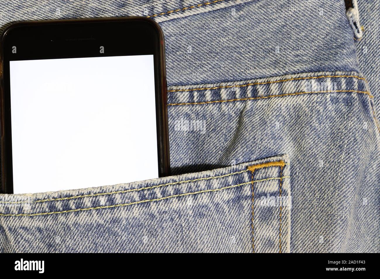 Mock up white screen phone peeping out of the pocket of light blue ...