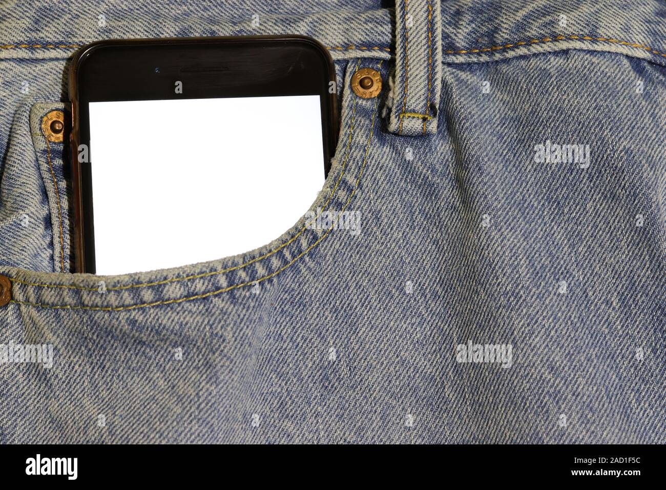 Mock up white screen phone peeping out of the pocket of light blue ...