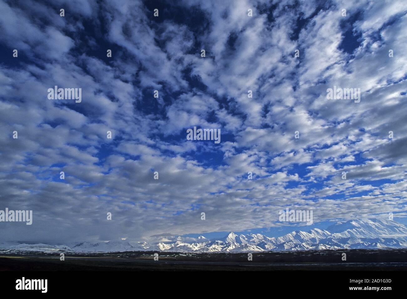 Mountain peaks of the Alaska Range, the Denali and clouds / Denali ...