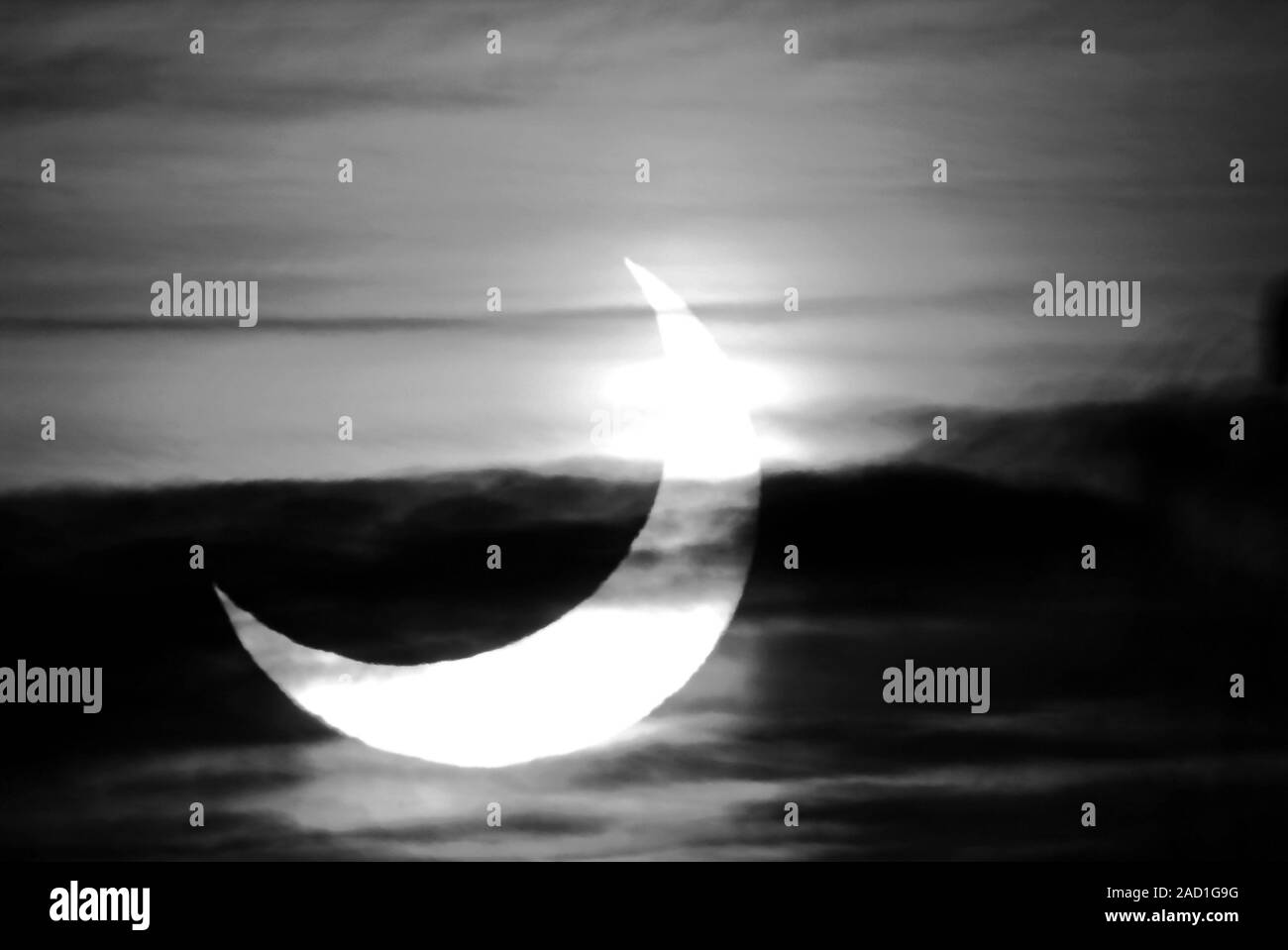 Solar eclipse. View the Moon (dark) moving in front of the Sun (bright ...