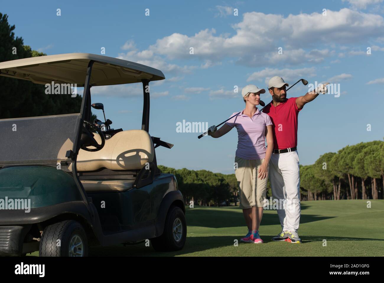 portrait of golfers couple on golf course Stock Photo - Alamy