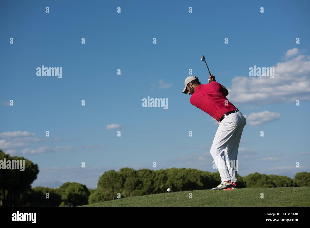 golf player hitting long shot Stock Photo - Alamy