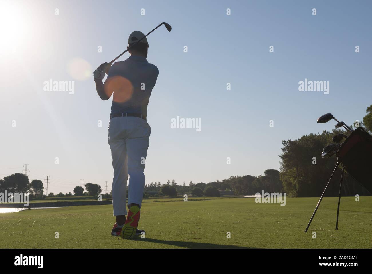 golf player hitting shot Stock Photo - Alamy