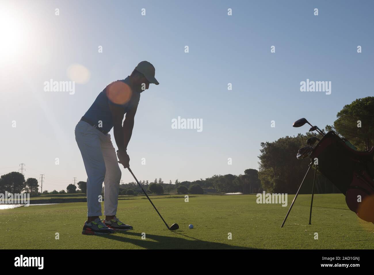 golf player hitting shot Stock Photo - Alamy
