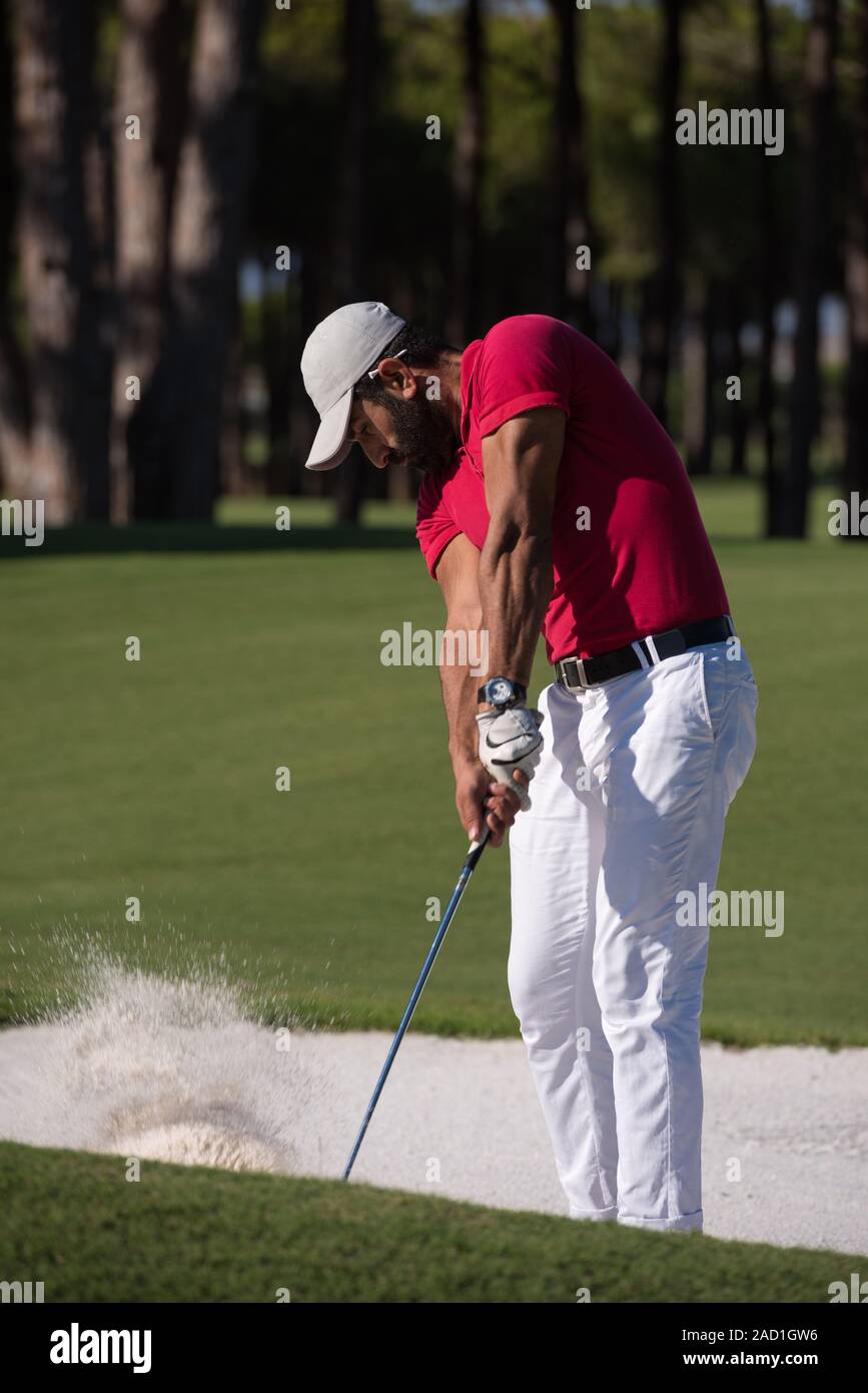 golfer hitting a sand bunker shot Stock Photo - Alamy
