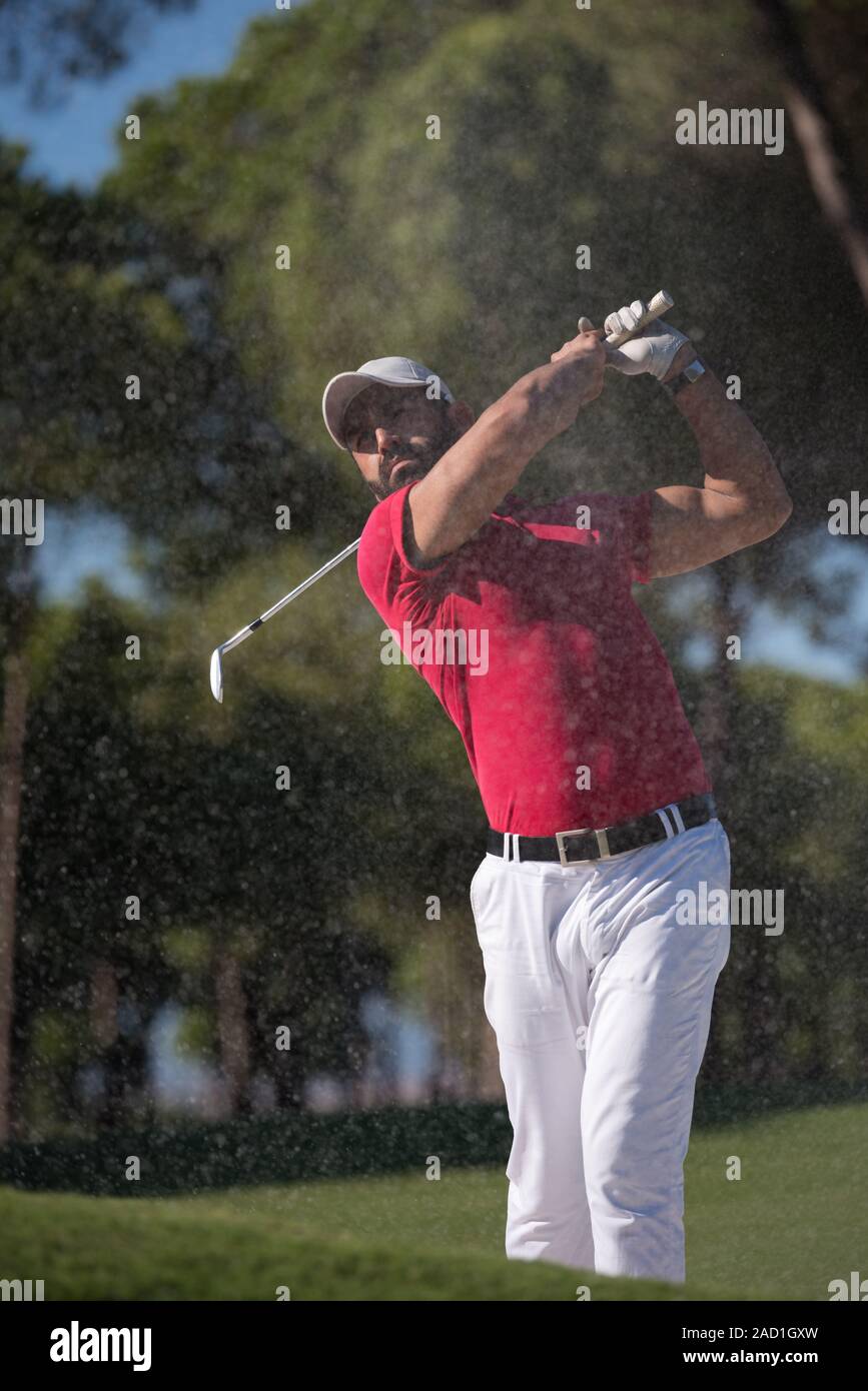 golfer hitting a sand bunker shot Stock Photo - Alamy