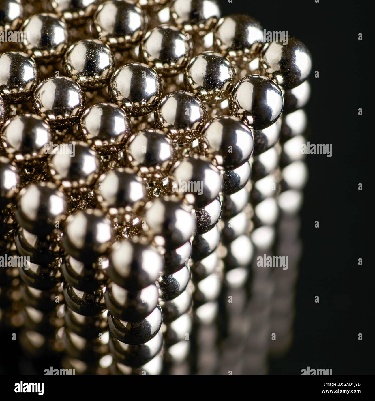 Super magnets. A cube made from 216 spherical neodymium super magnets ...